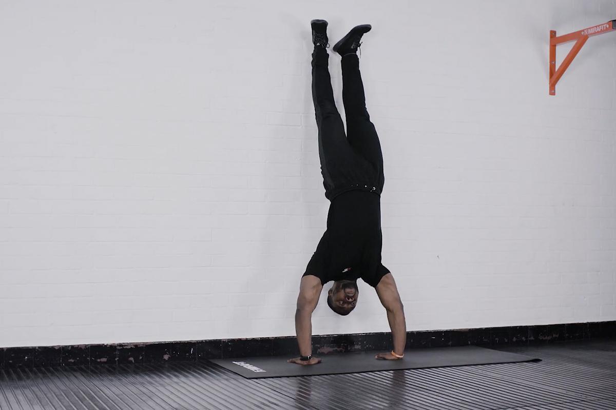 How to Master the Handstand Push-up | Mirafit